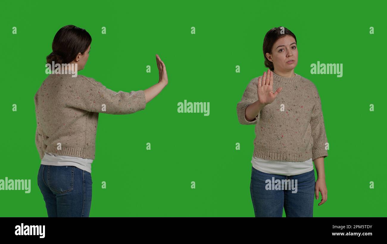 Close up of negative adult showing rejection gesture with palm ...