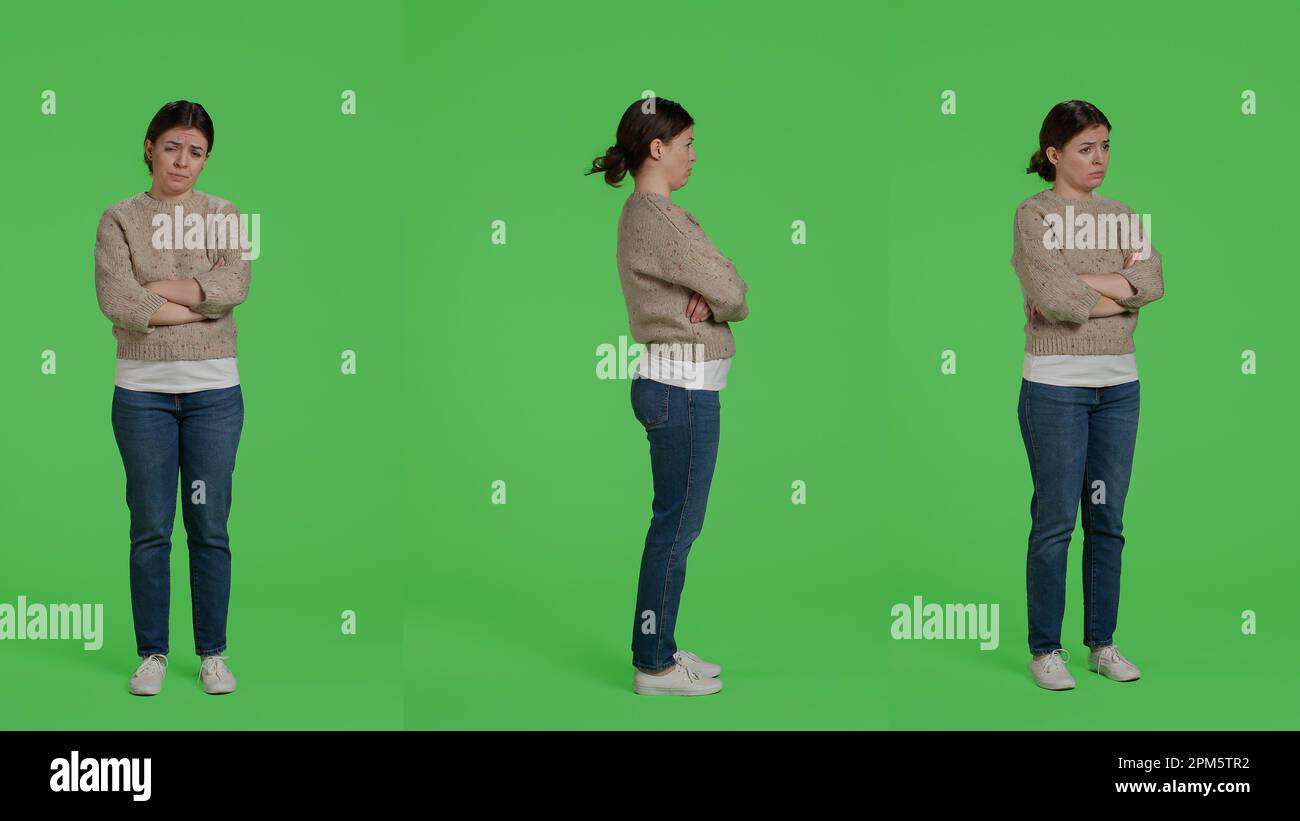 Displeased person acting sad and discouraged posing over isolated ...