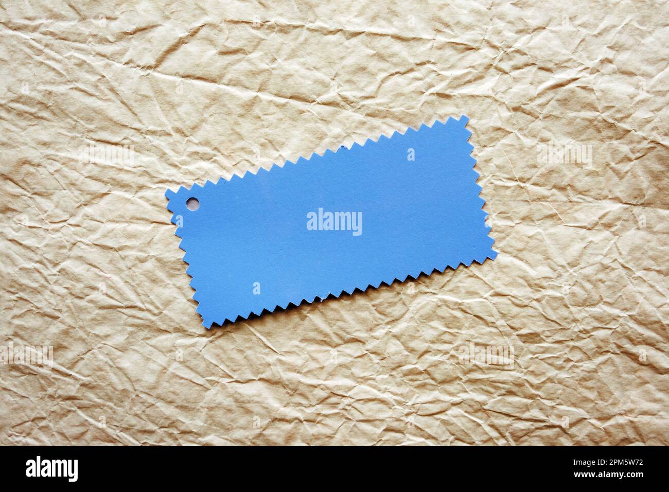 crumpled brown paper with card, decorative. paper textures Stock Photo ...