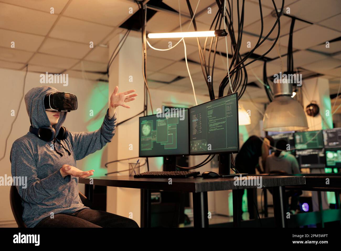 Cybercriminal working with professional vr glasses to crack encryption, trying to steal personal ...