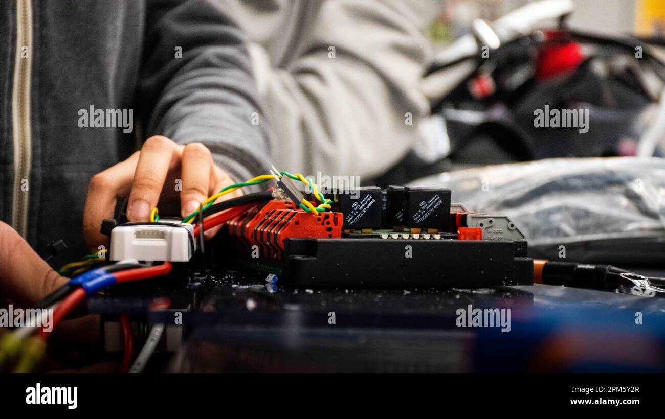 Student wiring first robotics robot for competition Stock Photo - Alamy