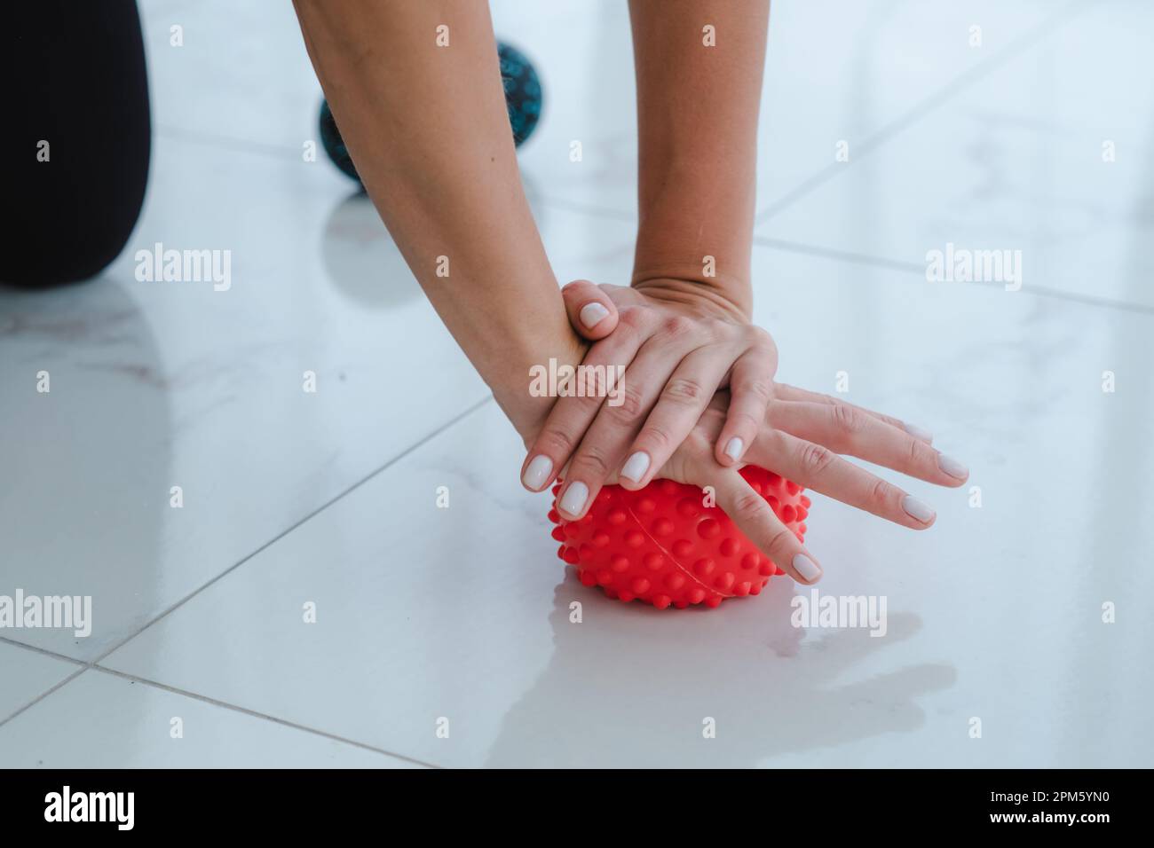 Woman hands pressing on small ball to relieve pain in arms massage ...