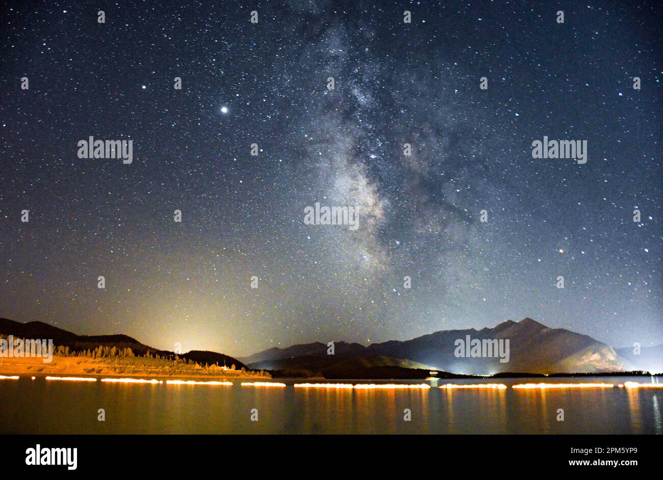 Starlights towering over rocky mountains Stock Photo - Alamy