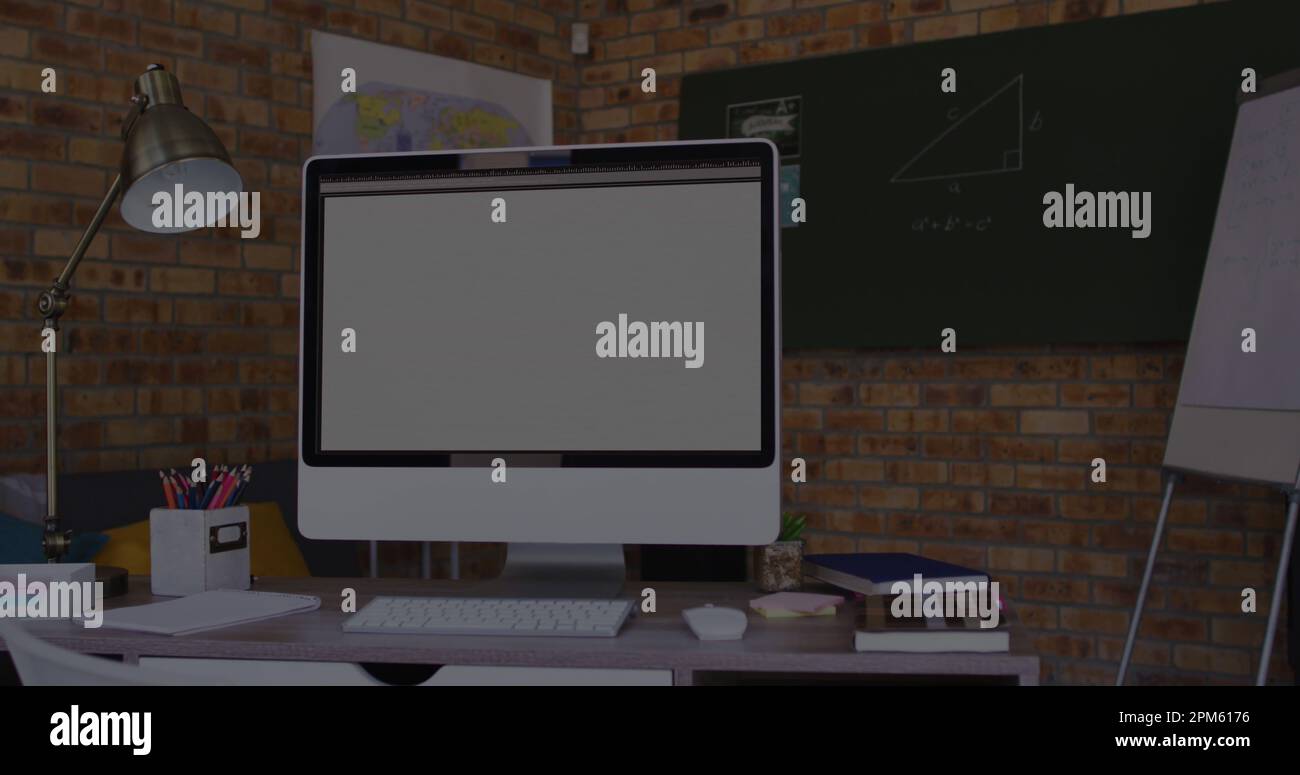 General view of office desk with computer with copy space on screen ...