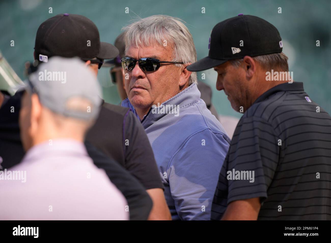 Colorado Rockies general manager Bill Schmidt look as on as players ...