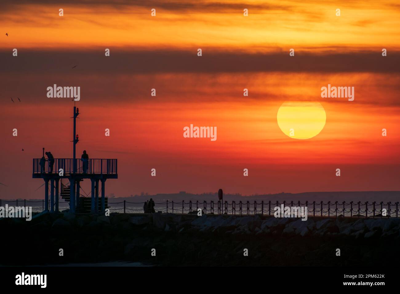 An early April sunset at Herne Bay with Neptune's Arm in the foreground ...