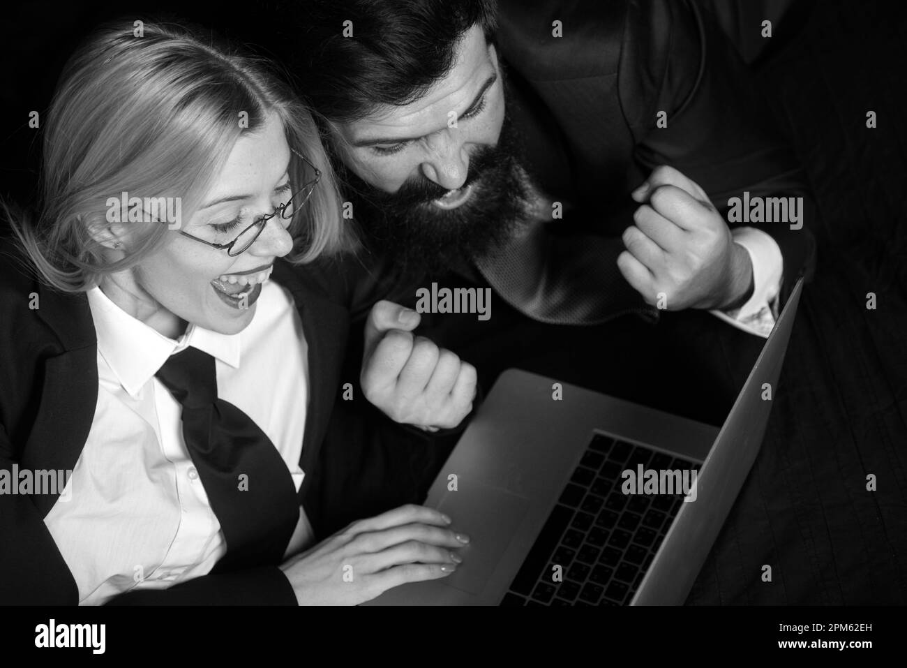 Couple being happy winning a bet in online sport gambling application ...