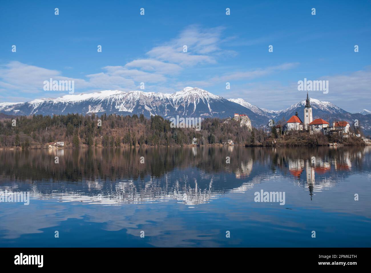 Lake Bled: Church of the Mother of God, and Bled Castle, with snowed ...