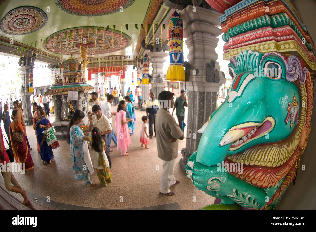Devotees and gaudy elephant painted column during Deepavali ceremony ...