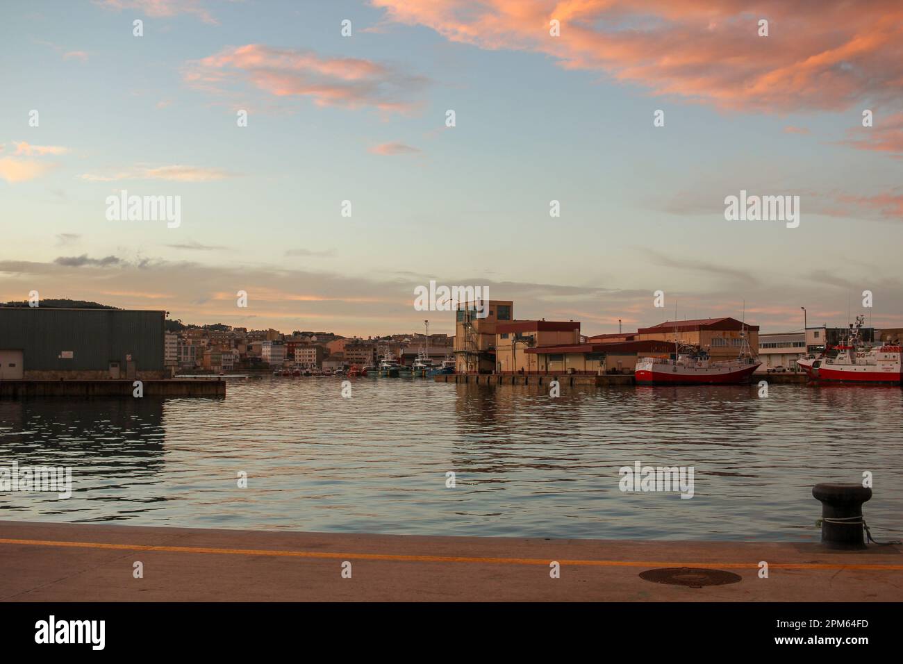 the port of Burela in Spain under the lights of sunset Stock Photo - Alamy