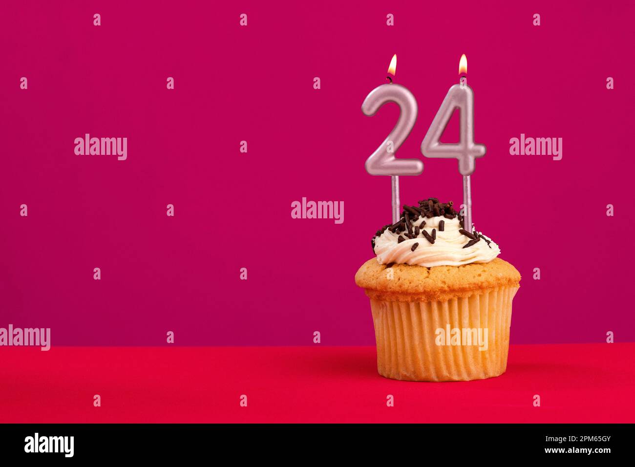 Candle number 24 - Cake birthday in rhodamine red background Stock ...