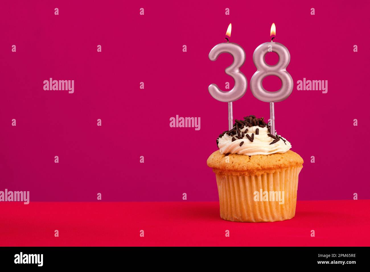Candle number 38 - Cake birthday in rhodamine red background Stock ...