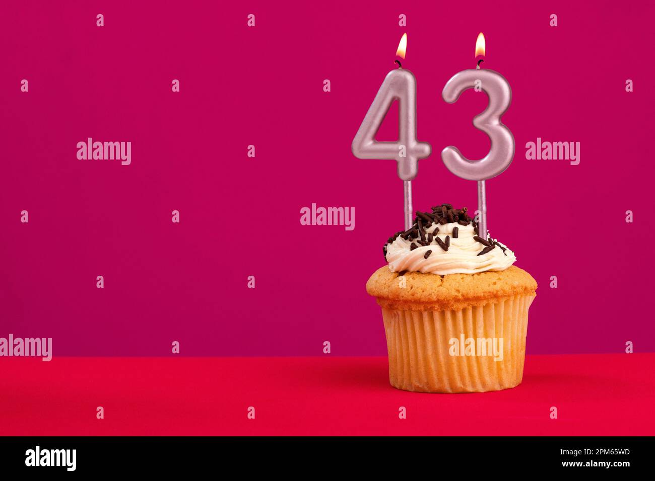 Birthday cake with candle number 43 - Rhodamine Red foamy background ...