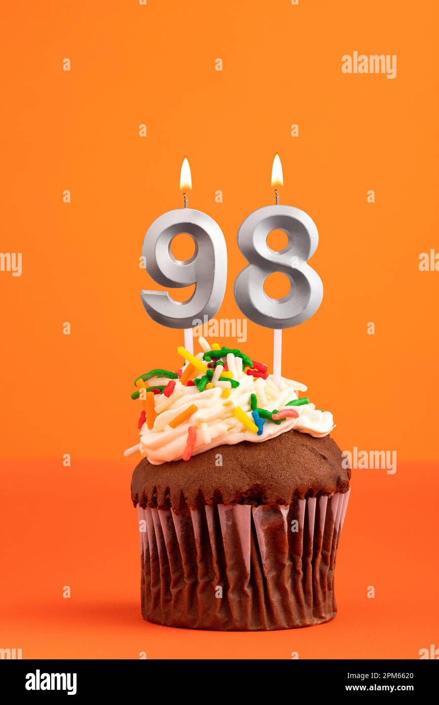 Birthday cake with candle number 98 - Orange foamy background Stock ...
