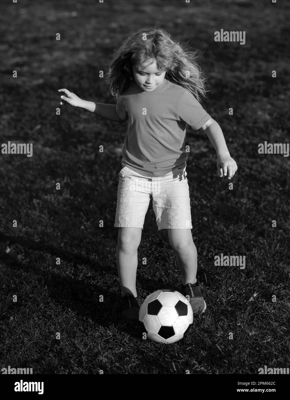 Soccer kid boy playing football. Child boy play football on outdoor ...