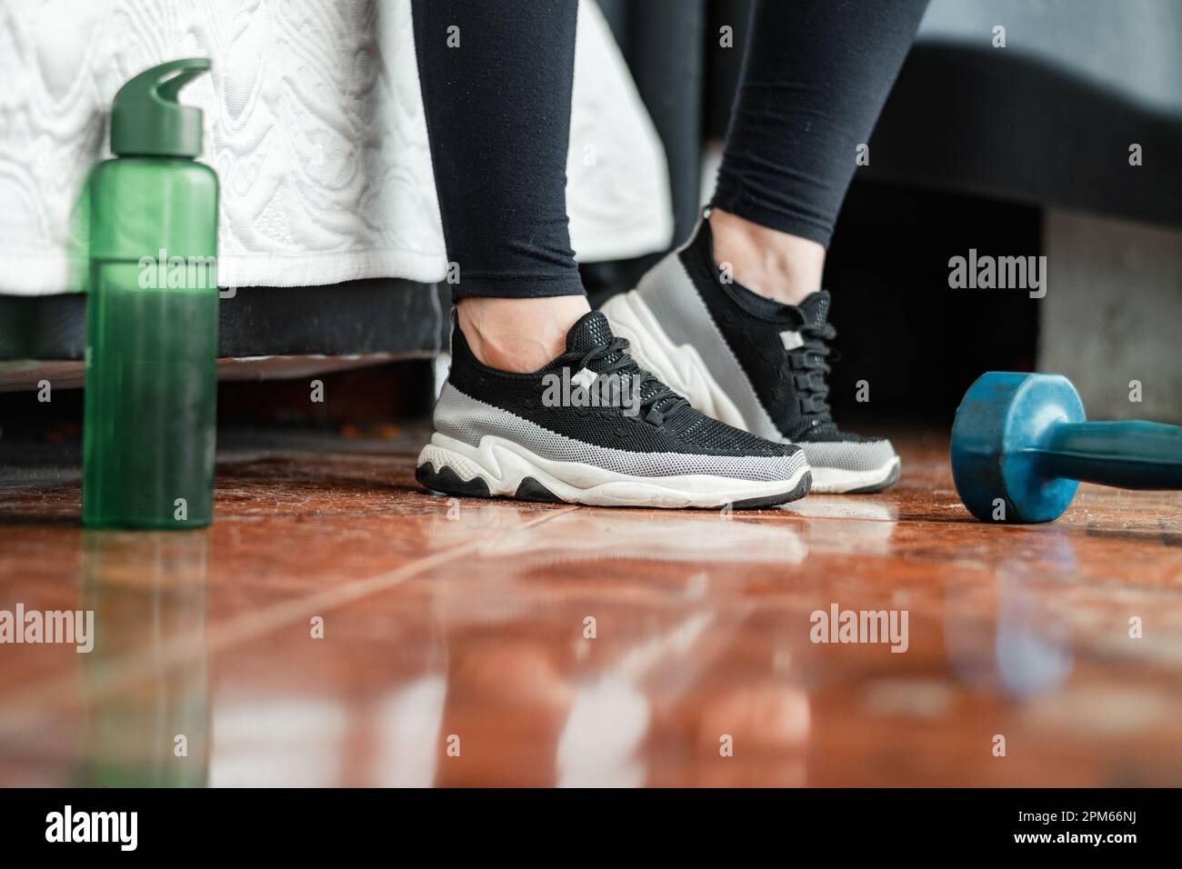 close-up of the feet of a girl getting ready to exercise, next to a ...