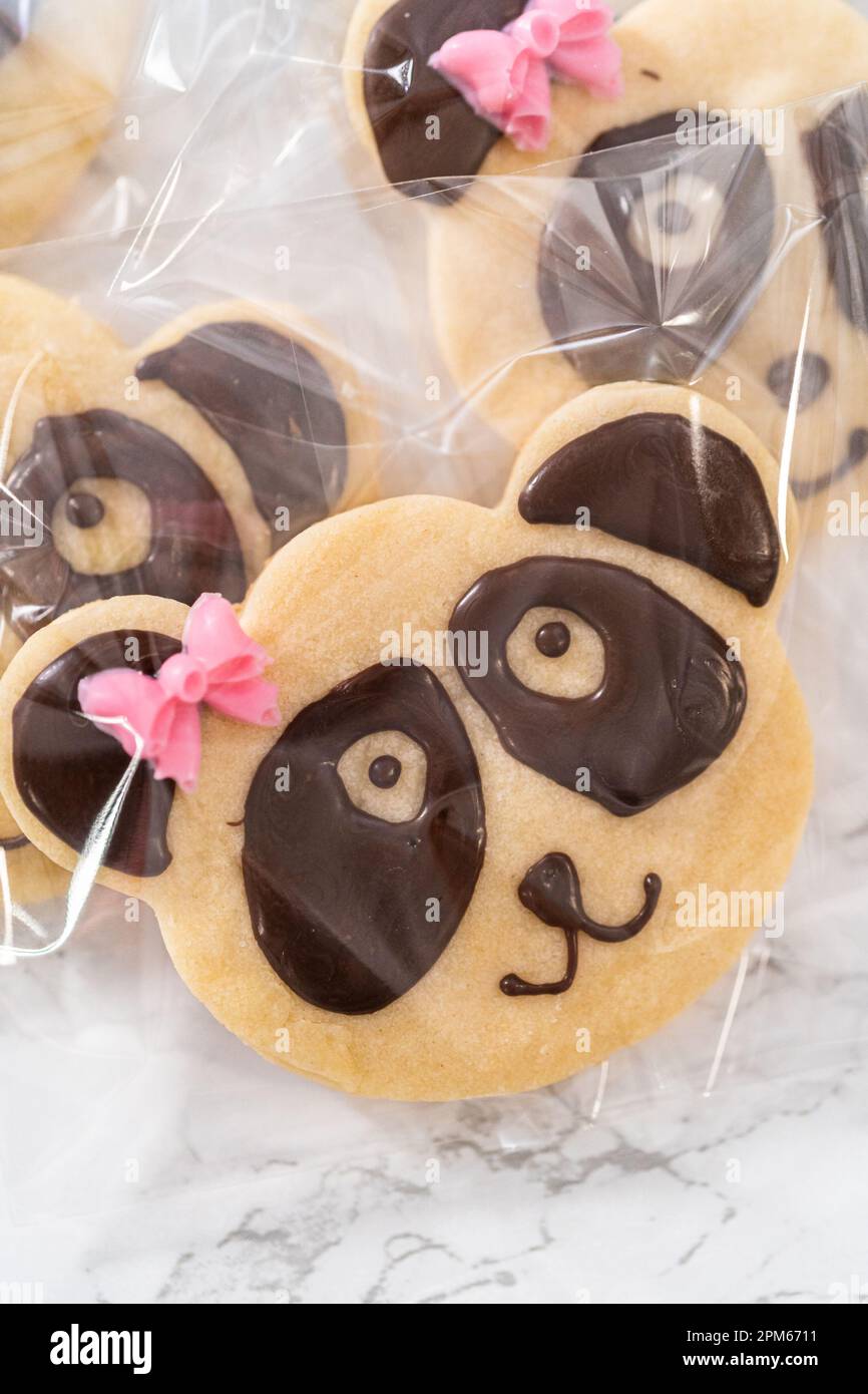 Panda shaped shortbread cookies with chocolate icing Stock Photo - Alamy