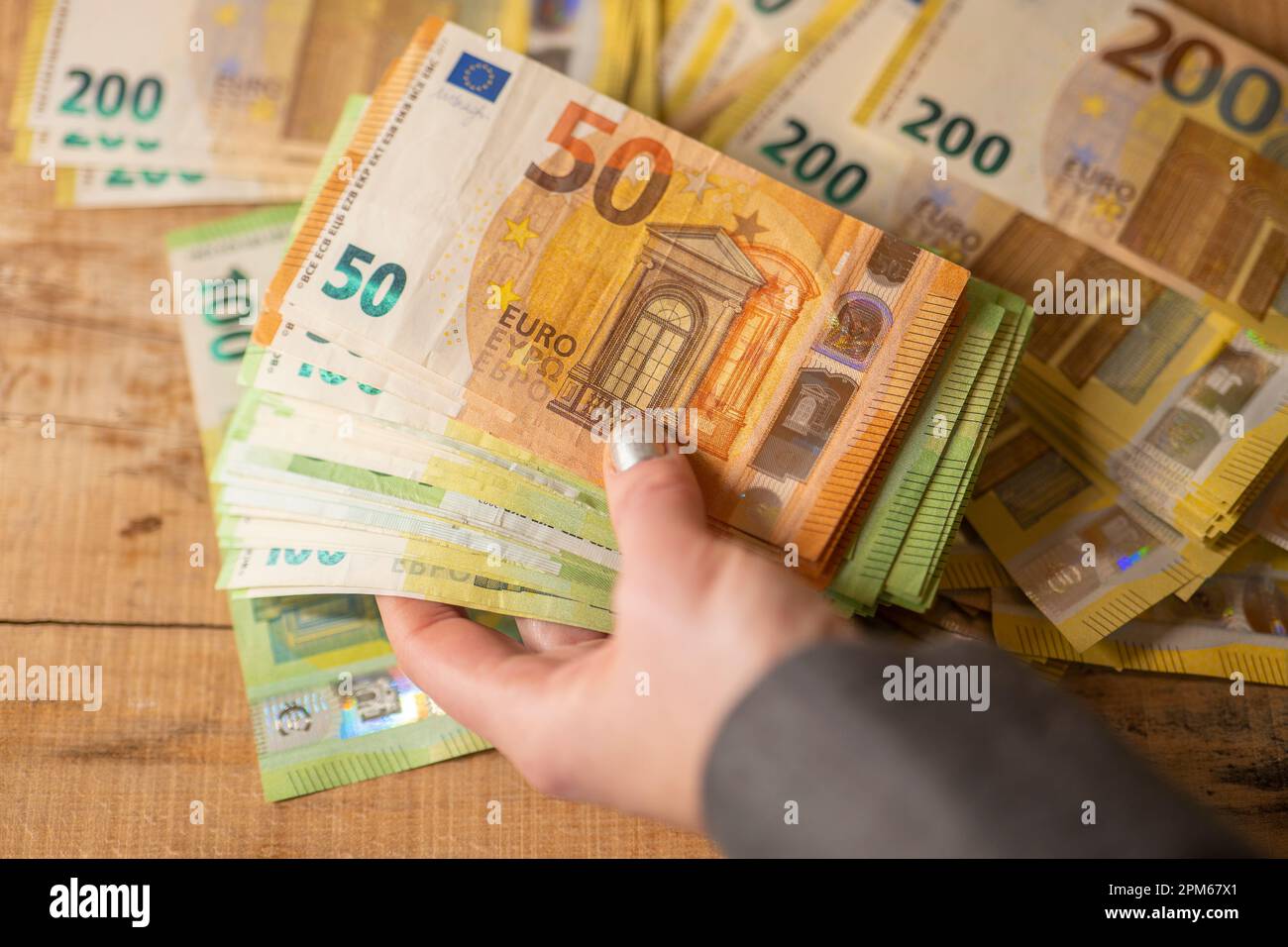 Recalculation of money. Counting euro banknotes.Hands recalculate ...