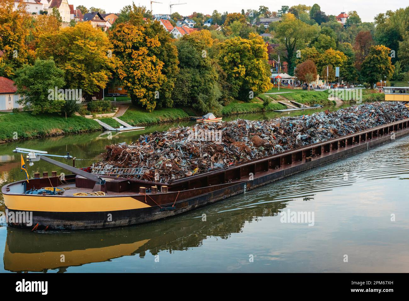 Transportation industry. Ship barge transports scrap metal and sand ...
