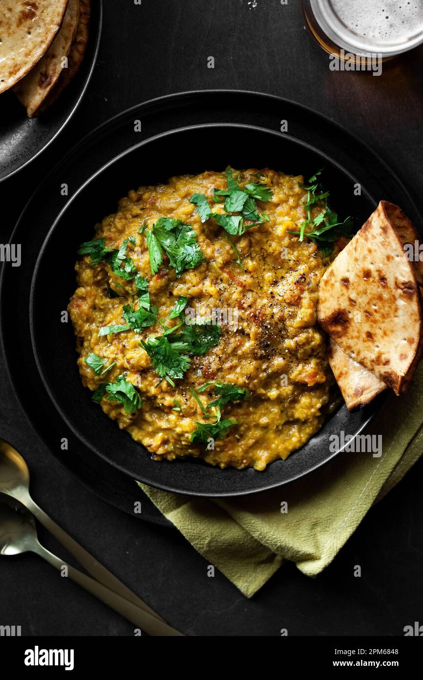Indian Tarka Dal Curry with Roti and Beer Stock Photo - Alamy
