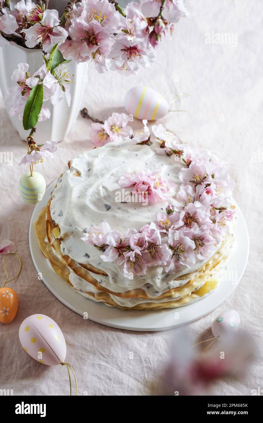 crepe cake or blini cake for Easter party, rose pink background, almond ...
