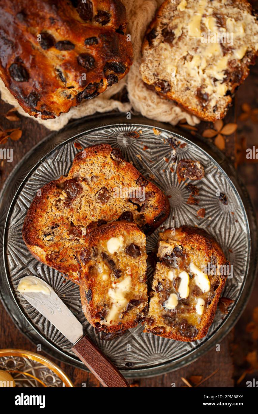 Toasted Fruit Bread covered in butter Stock Photo - Alamy