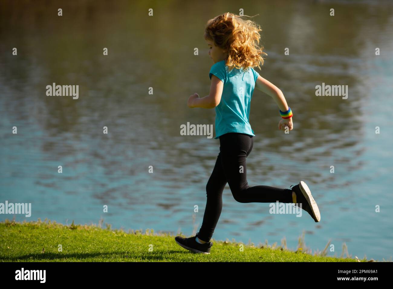 Kid runners run on lawn in park. Child running outdoor. Healthy sport ...