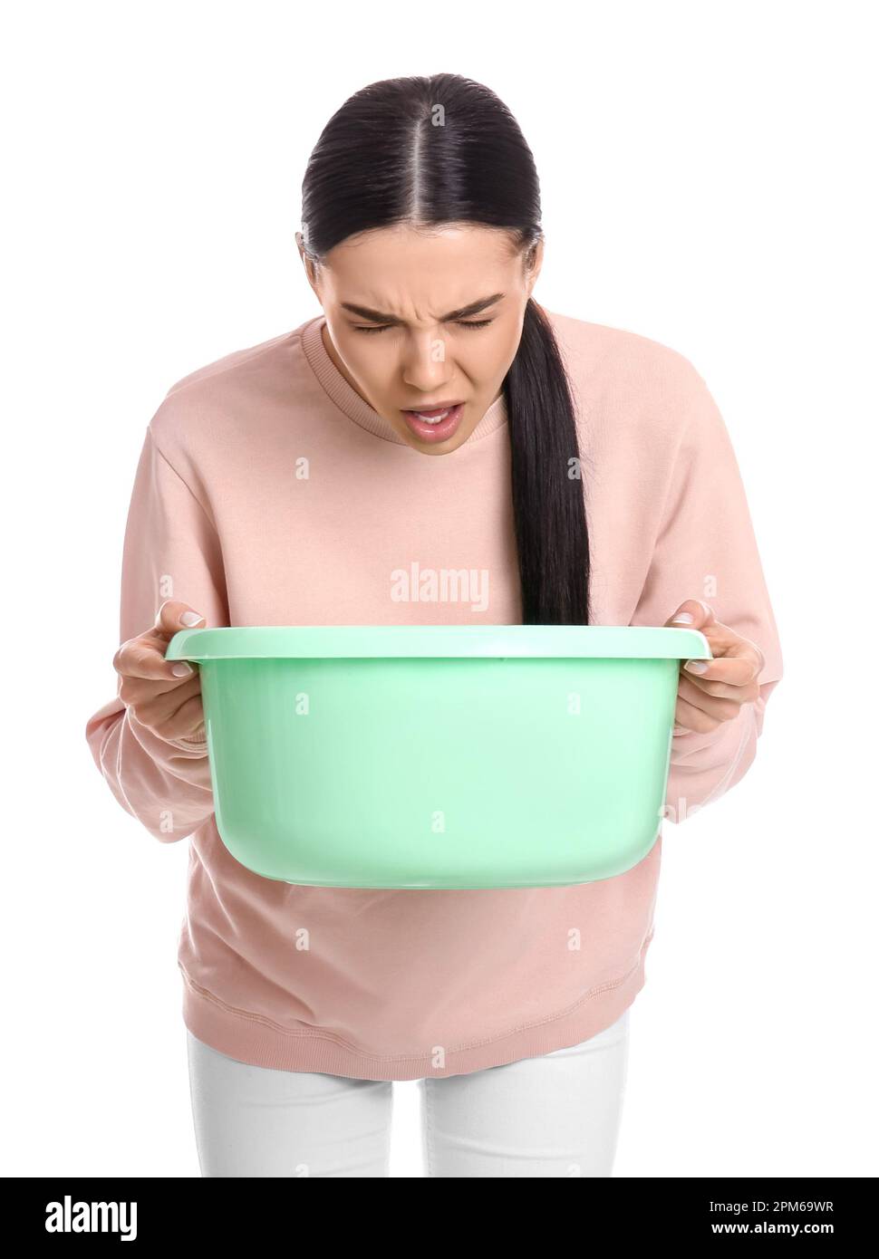 Woman with basin suffering from nausea on white background. Food ...