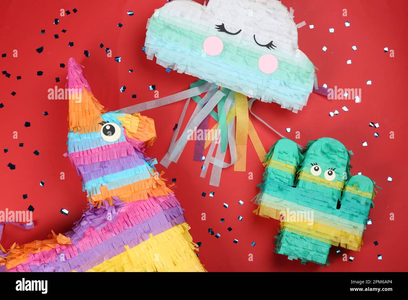 Different bright pinatas on red background, flat lay Stock Photo - Alamy