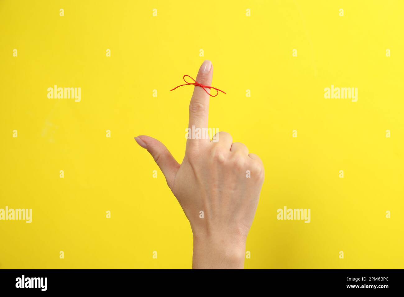Woman index finger remember hi-res stock photography and images - Alamy
