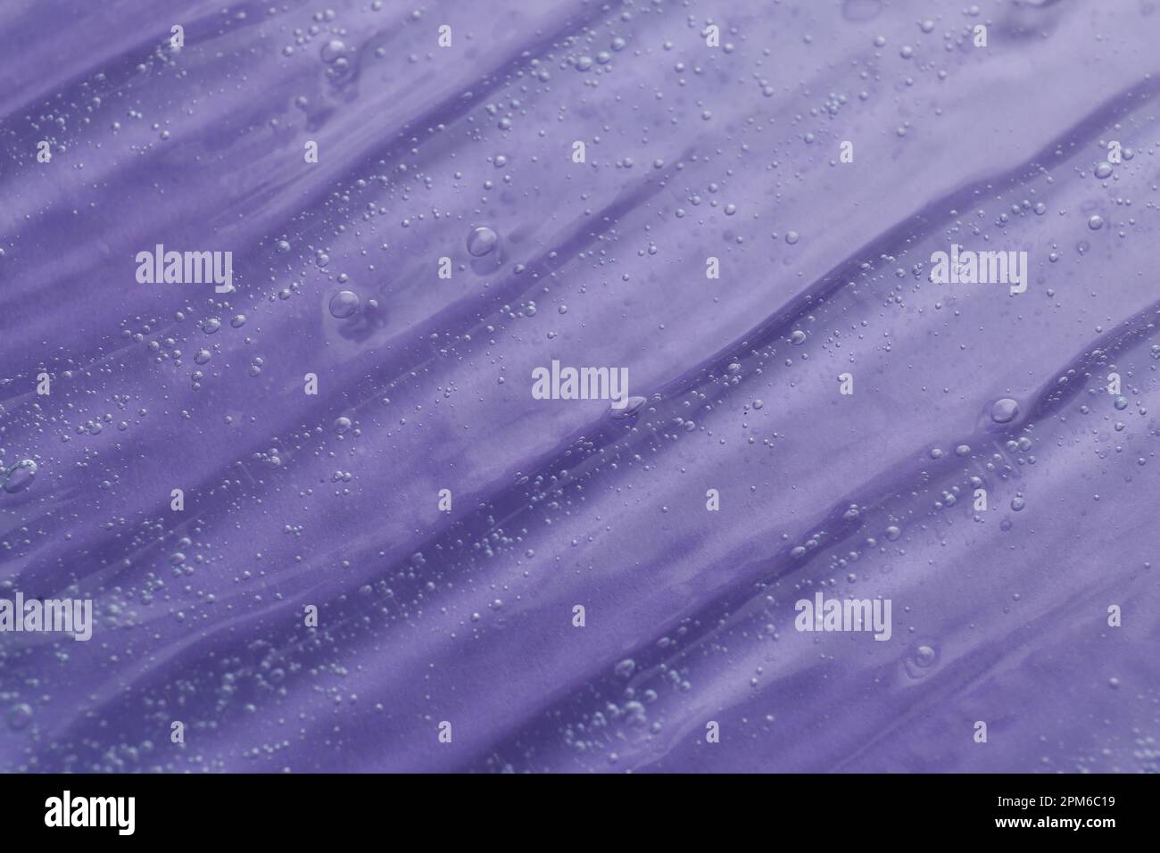 Texture of transparent shower gel on violet background, closeup Stock ...