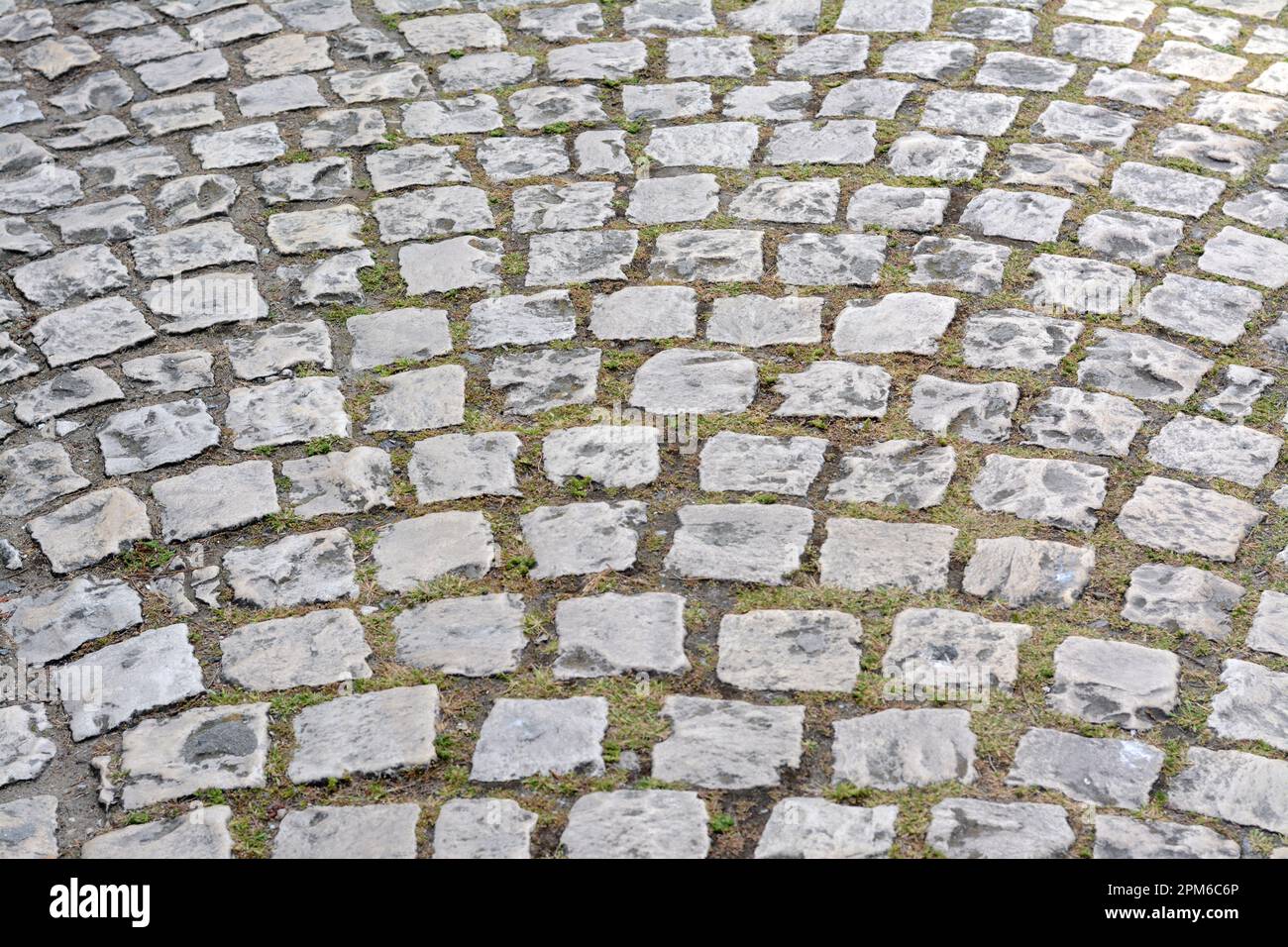 Old stone pathway with grass as background Stock Photo - Alamy