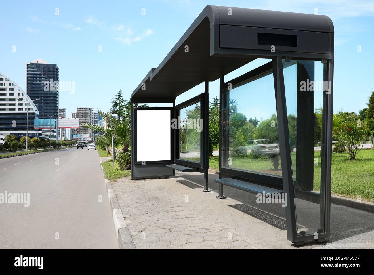 Public transport stop with benches on city street Stock Photo - Alamy
