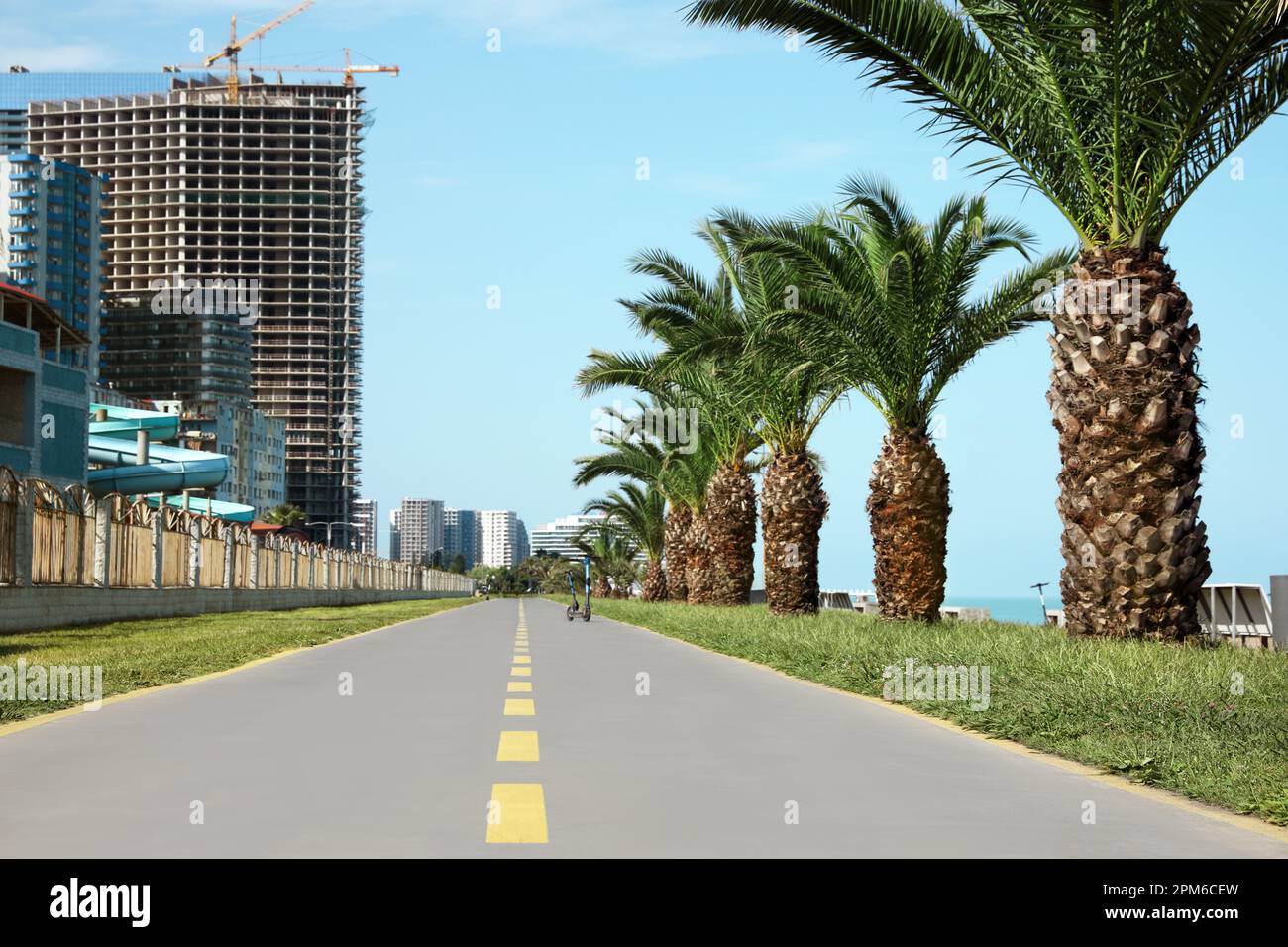 Bicycle lane with yellow dividing lines painted on asphalt Stock Photo ...