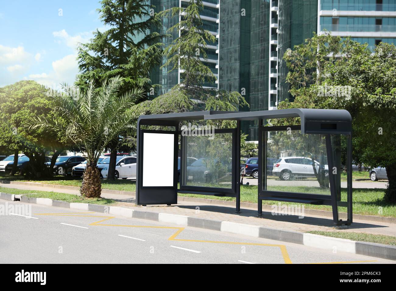 Public transport stop with benches on city street Stock Photo - Alamy