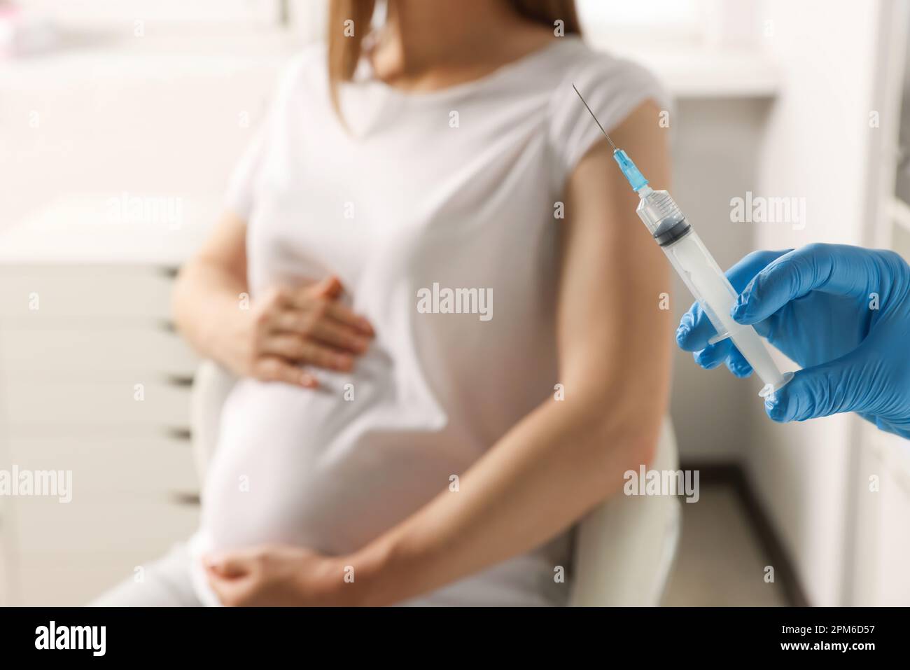 Doctor giving injection to pregnant woman in hospital, closeup Stock ...