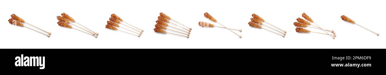 Set of wooden sticks with sugar crystals on white background, banner ...