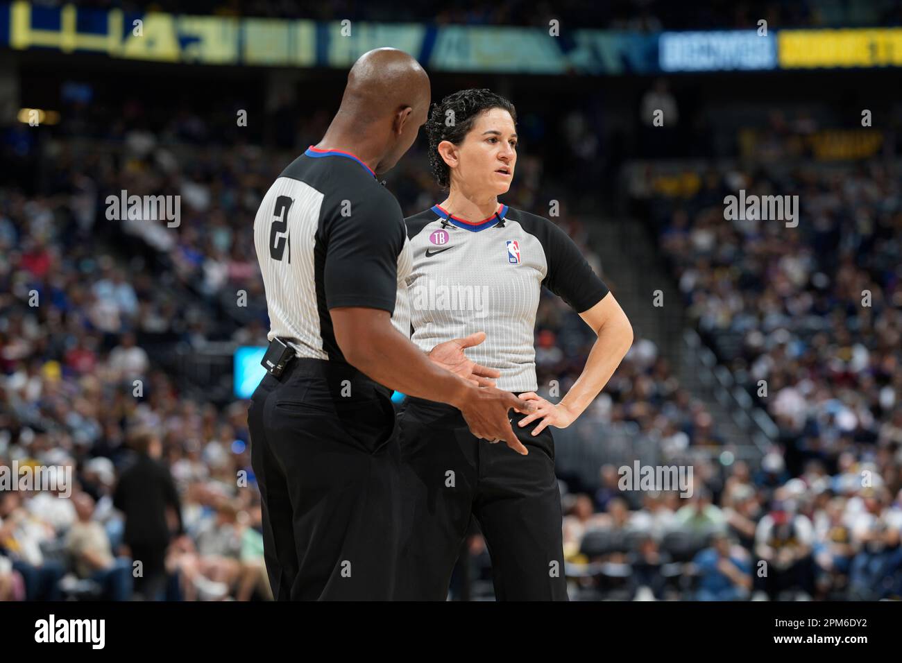 Referee Dedric Taylor (21) chats with referee Cheryl Flores (91) in the ...