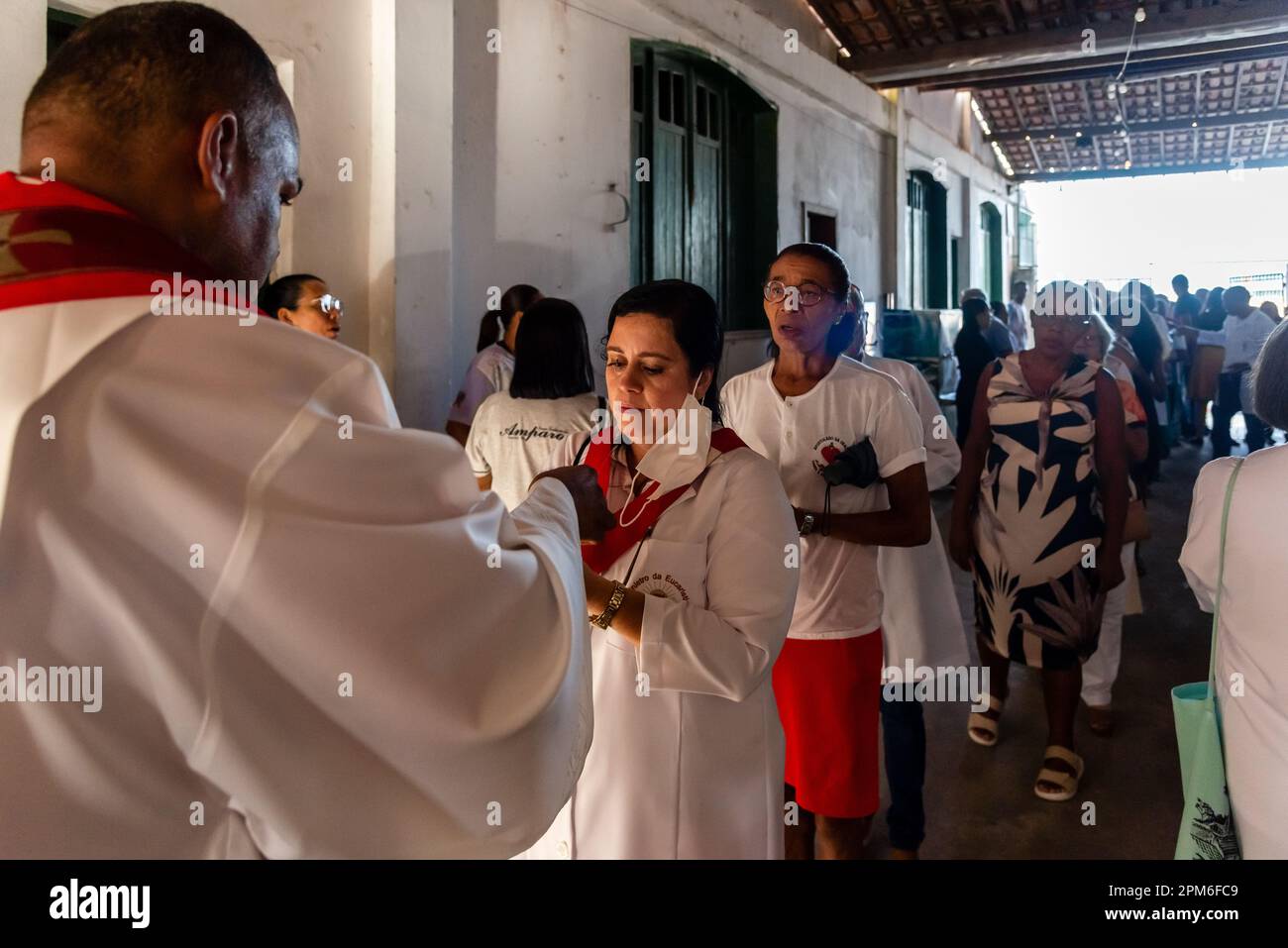 Salvador, Bahia, Brazil - April 07, 2023: Catholic faithful receiving a ...