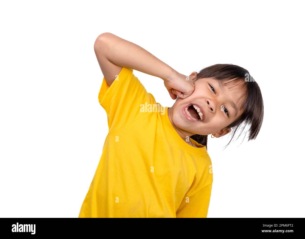 Asian girl making a funny face with one hand punching her cheek ...