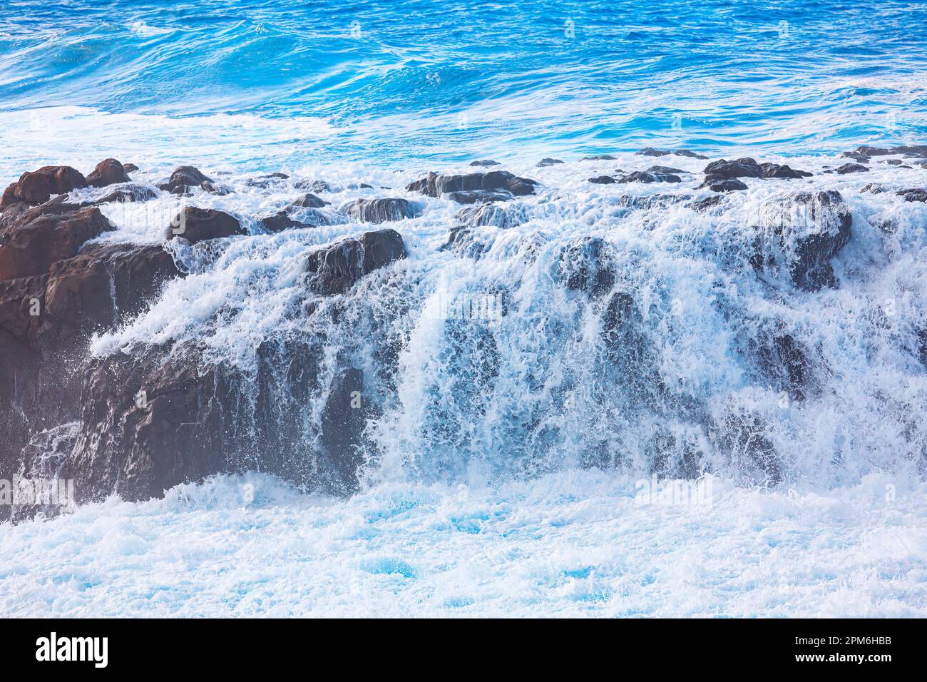Ocean waves over rocks . Water cascade in the ocean Stock Photo - Alamy