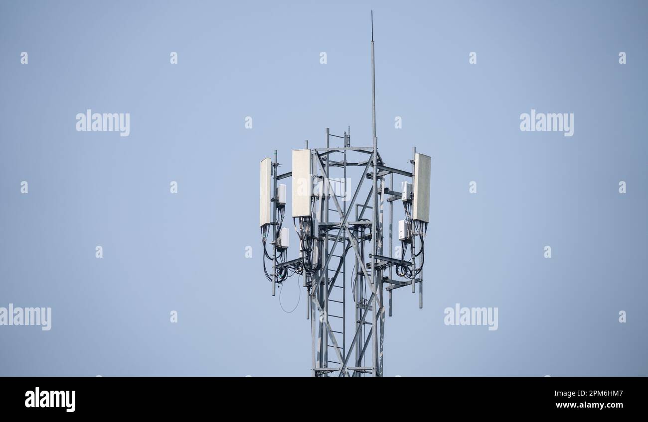 Telecommunication tower. Antenna on gray sky. Radio and satellite pole ...
