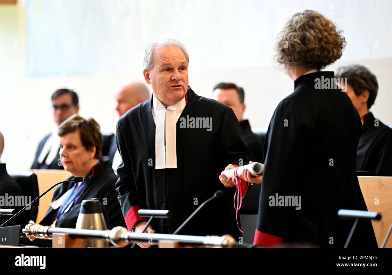 Justice David Boddice (centre) is seen being sworn in to the Court of ...