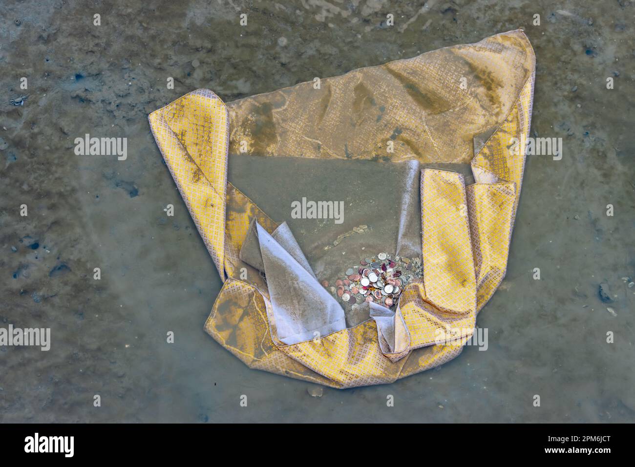 A decoration fabric with coins on a seabed in the mouth of the Chao ...