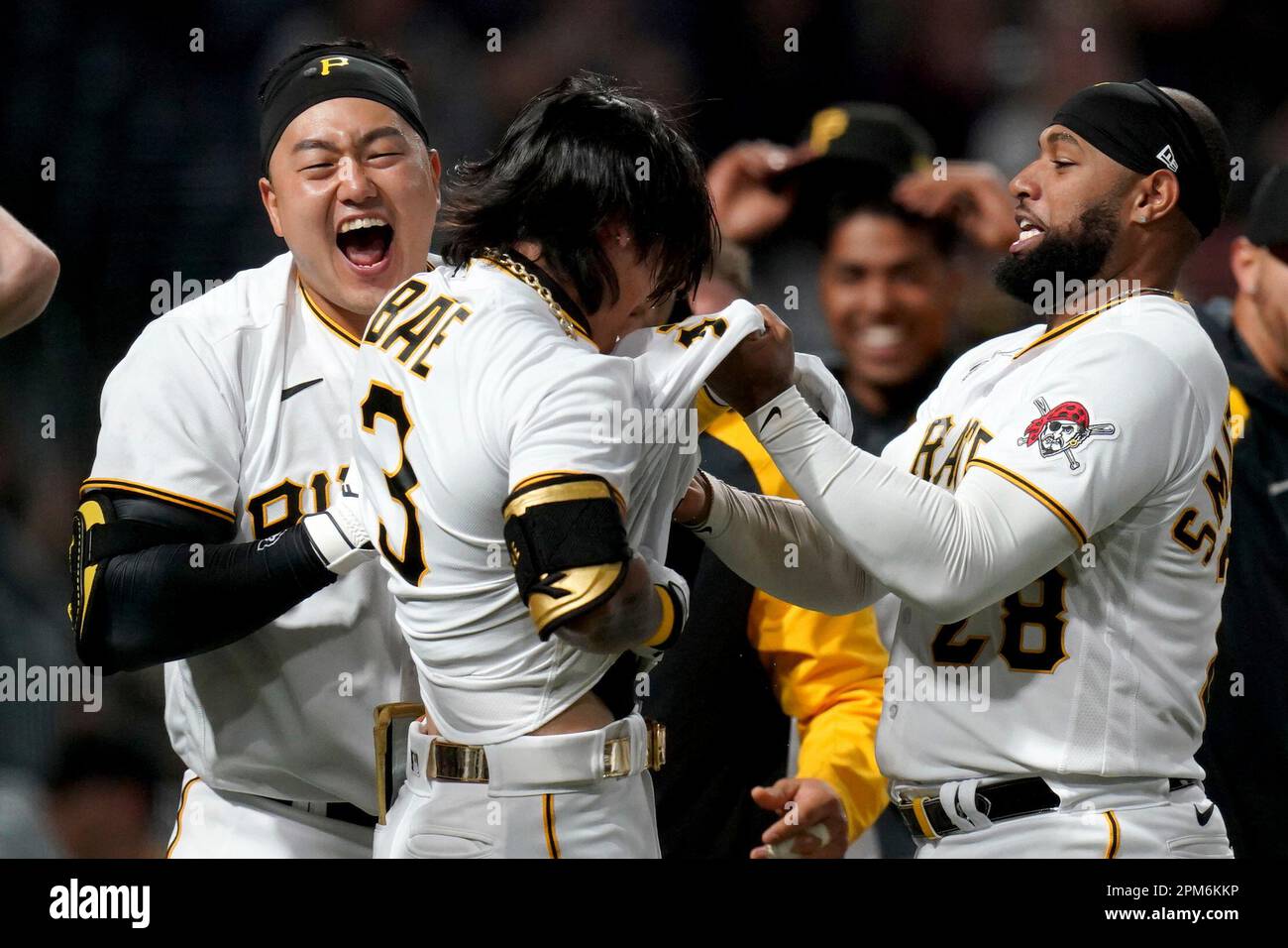 Pittsburgh Pirates' Ji Hwan Bae, center, is congratulated by Ji Man ...