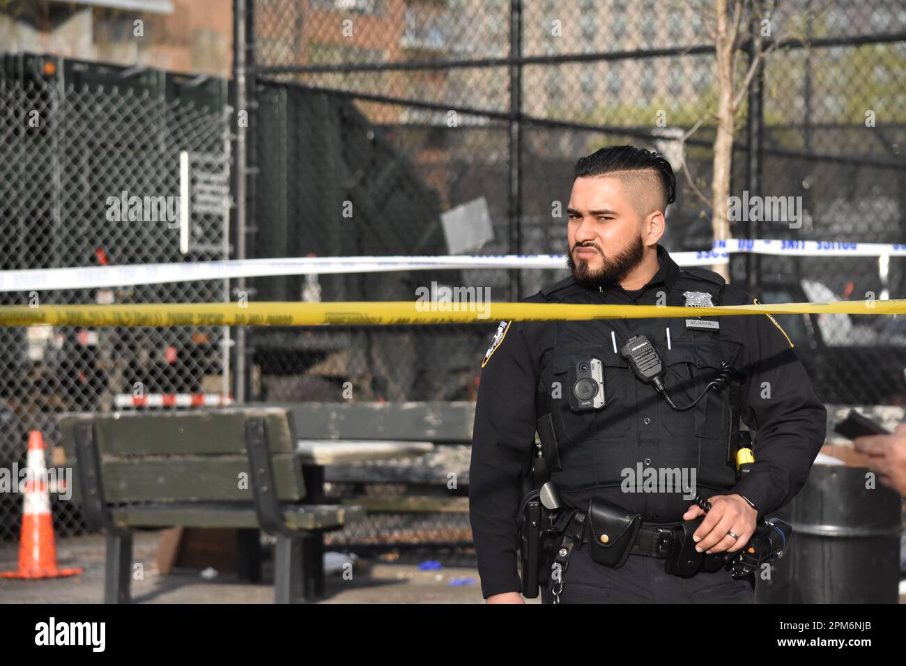 Police watch over the crime scene and prevent people from walking into ...