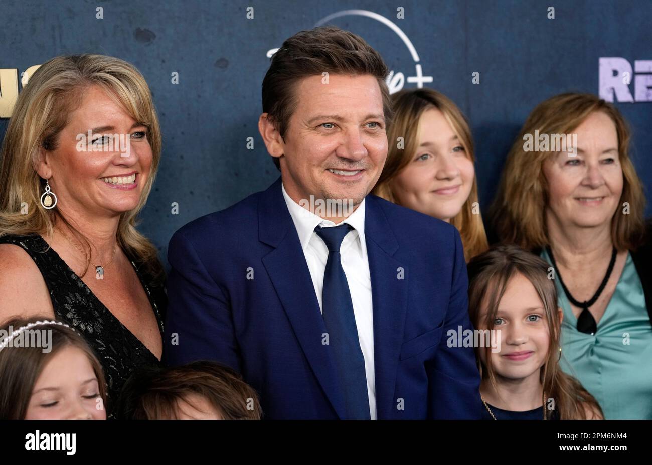 Jeremy Renner, center, the host and executive producer of ...