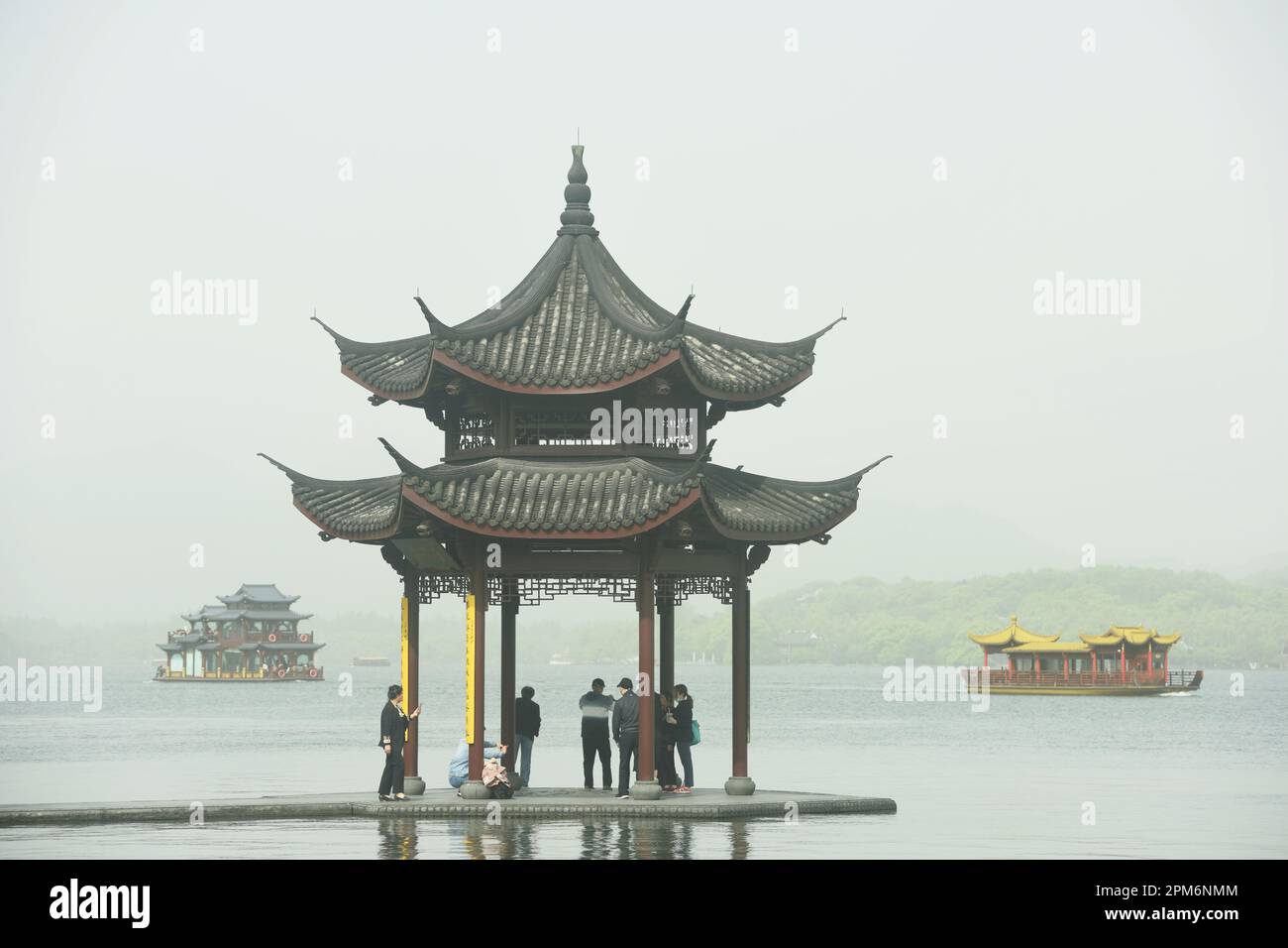 HANGZHOU, CHINA - APRIL 12, 2023 - People visit the West Lake amid haze ...