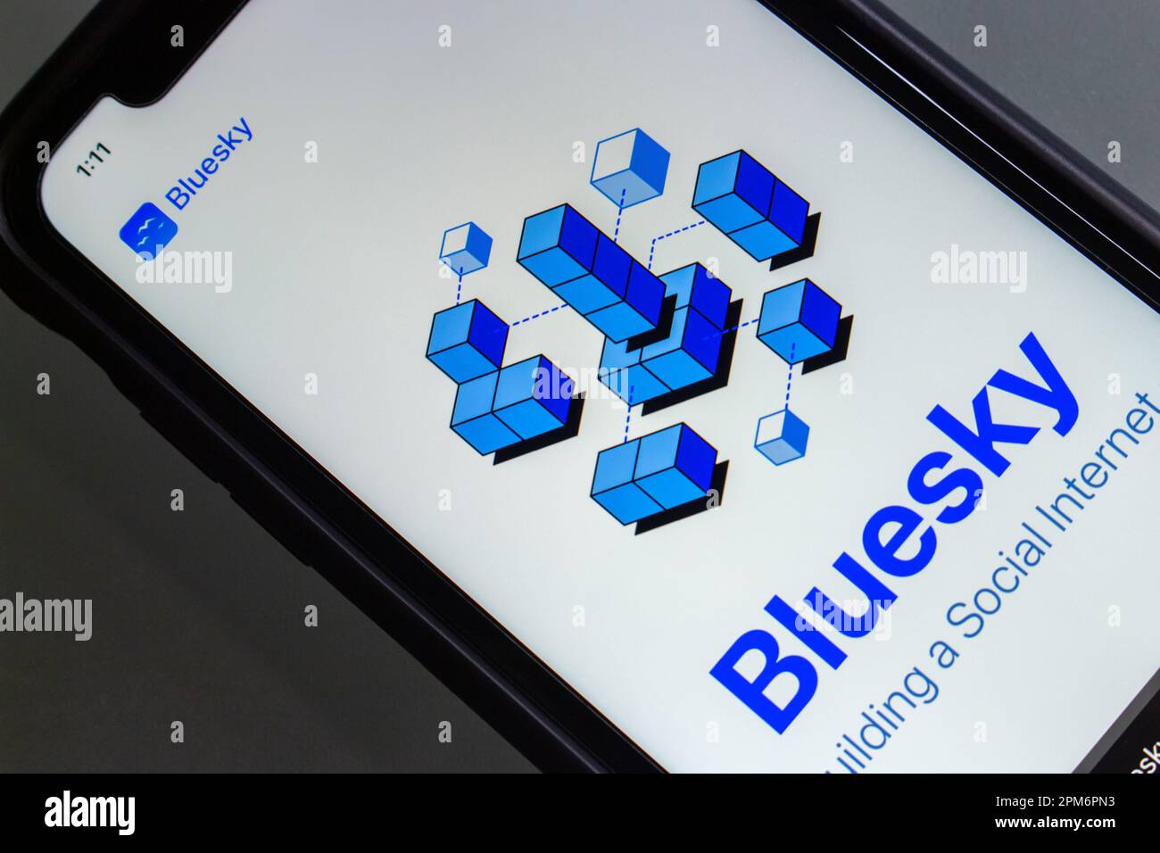 Website of Twitter alternative Bluesky Social seen in an iPhone screen ...