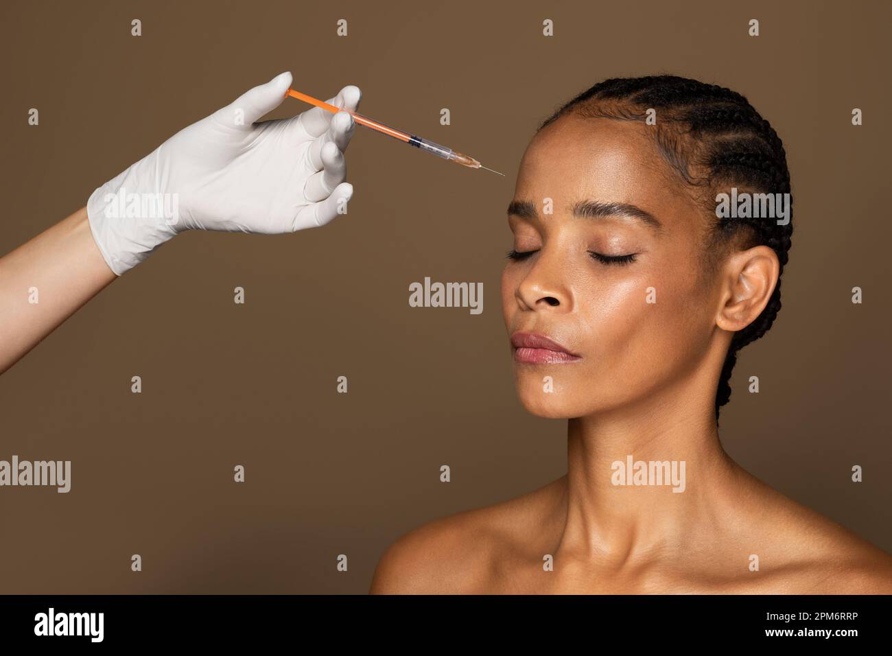 Skin lifting concept. Headshot of black middle aged woman receiving ...
